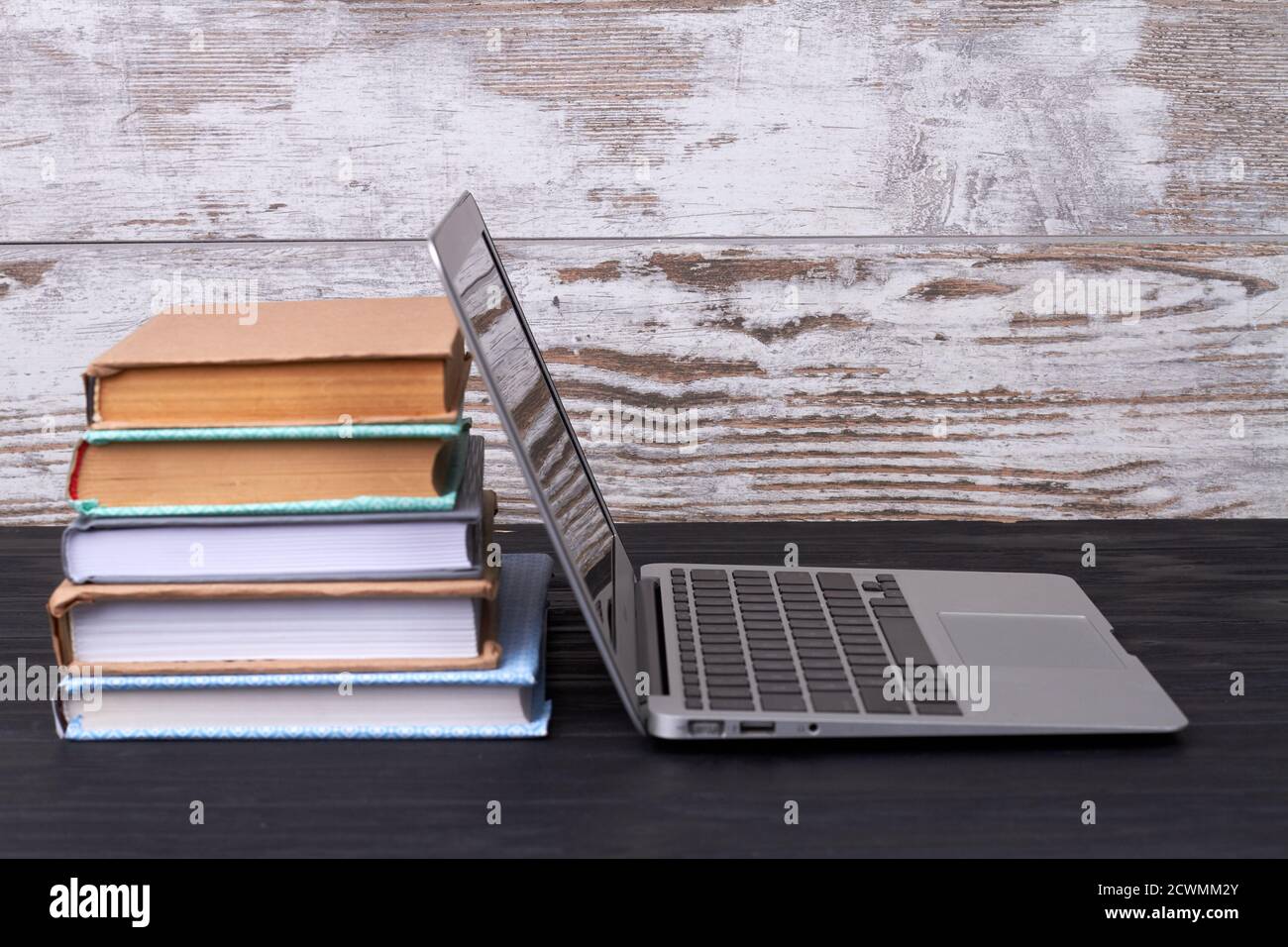 Book reading laptop stack hi-res stock photography and images - Alamy