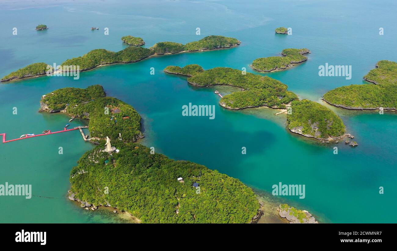 Islands in blue water covered with vegetation with beaches and bays ...