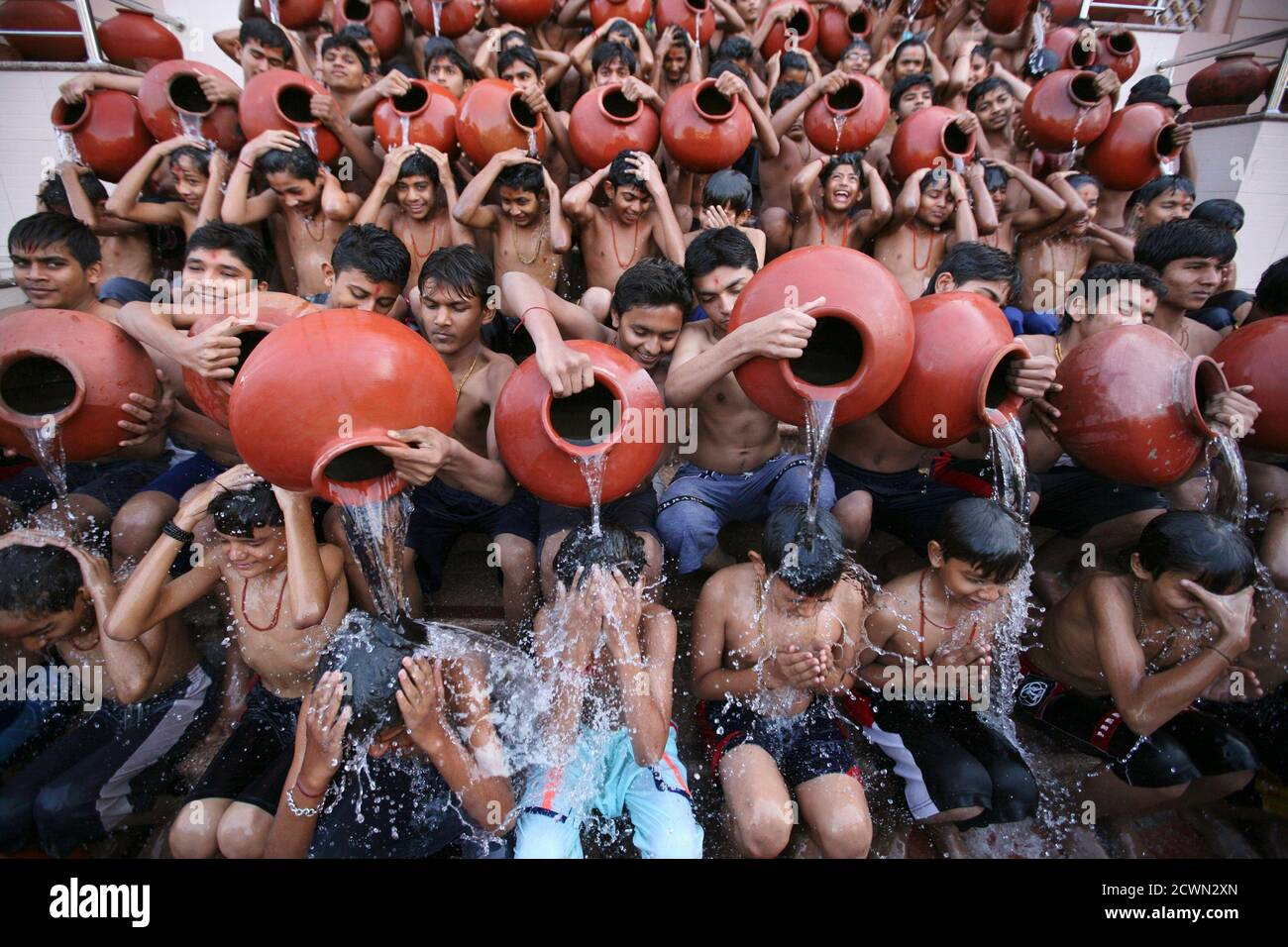 Hindu devotees take holy dip hi-res stock photography and images - Alamy