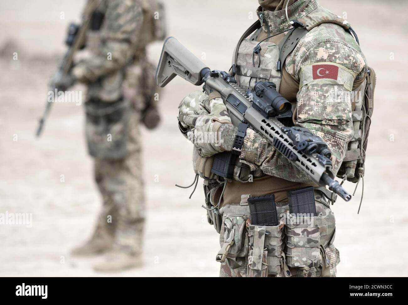 Soldiers with assault rifle and flag of Turkey on military uniform ...
