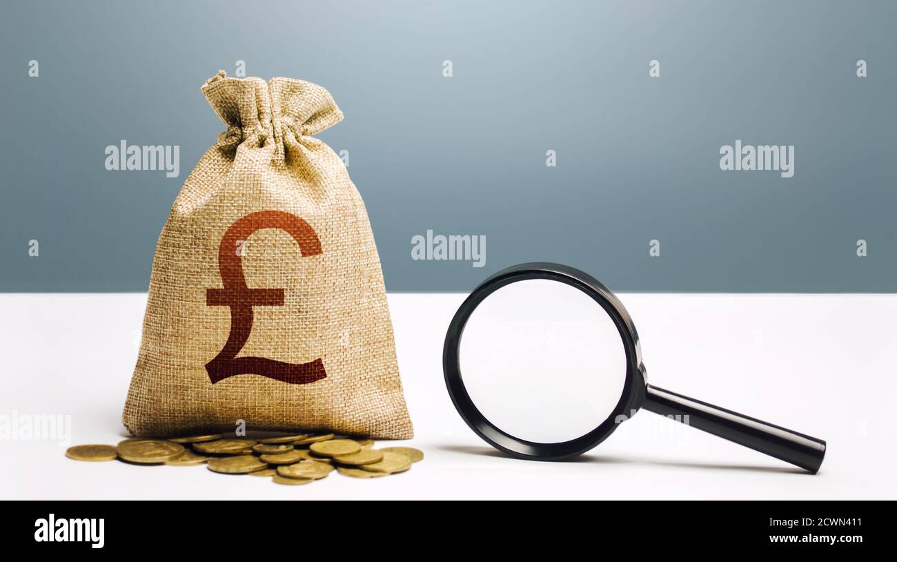 British pound sterling money bag and magnifying glass. Financial audit ...