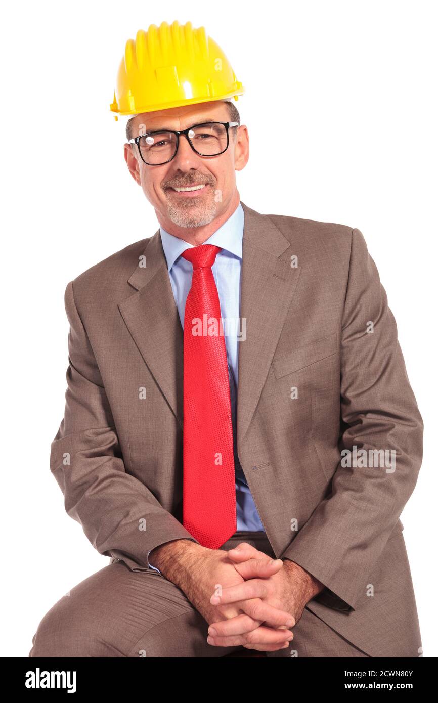 seated happy construction engineer smiling to the camera on white ...