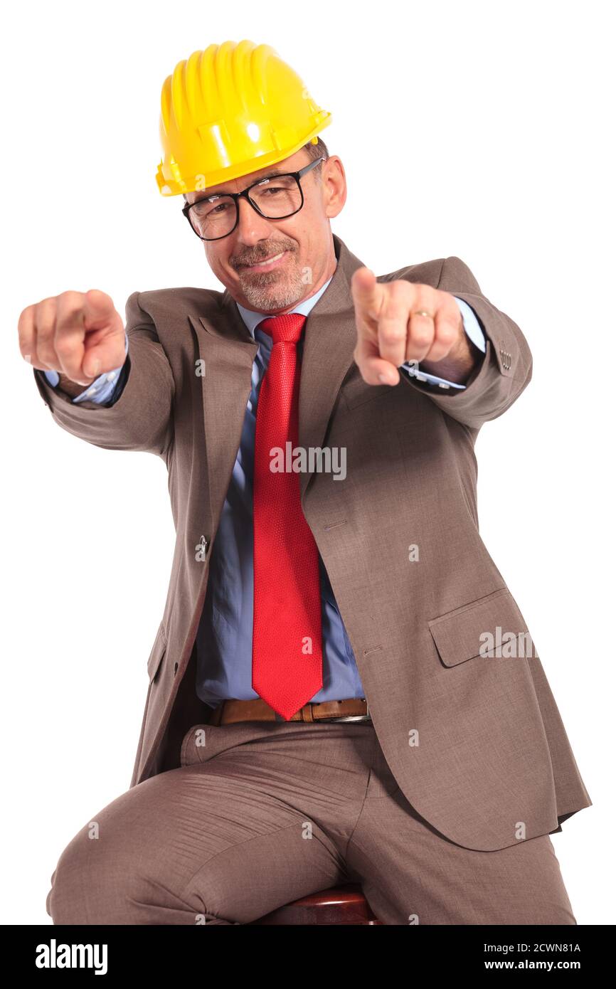 happy senior construction engineer pointing fingers to the camera on ...