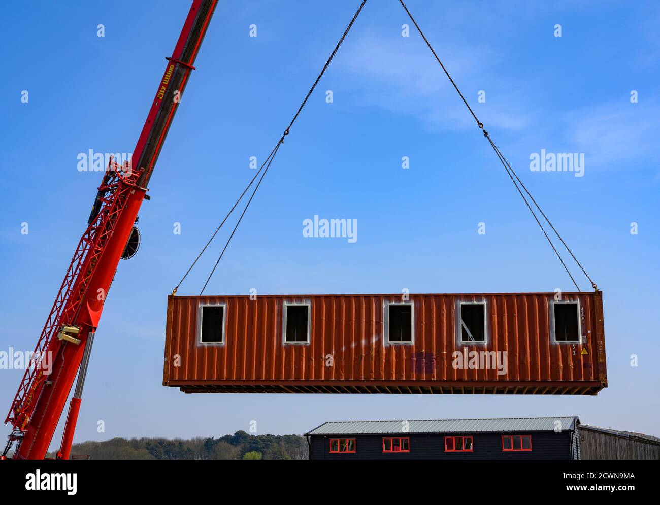cabin lifted into position Stock Photo - Alamy
