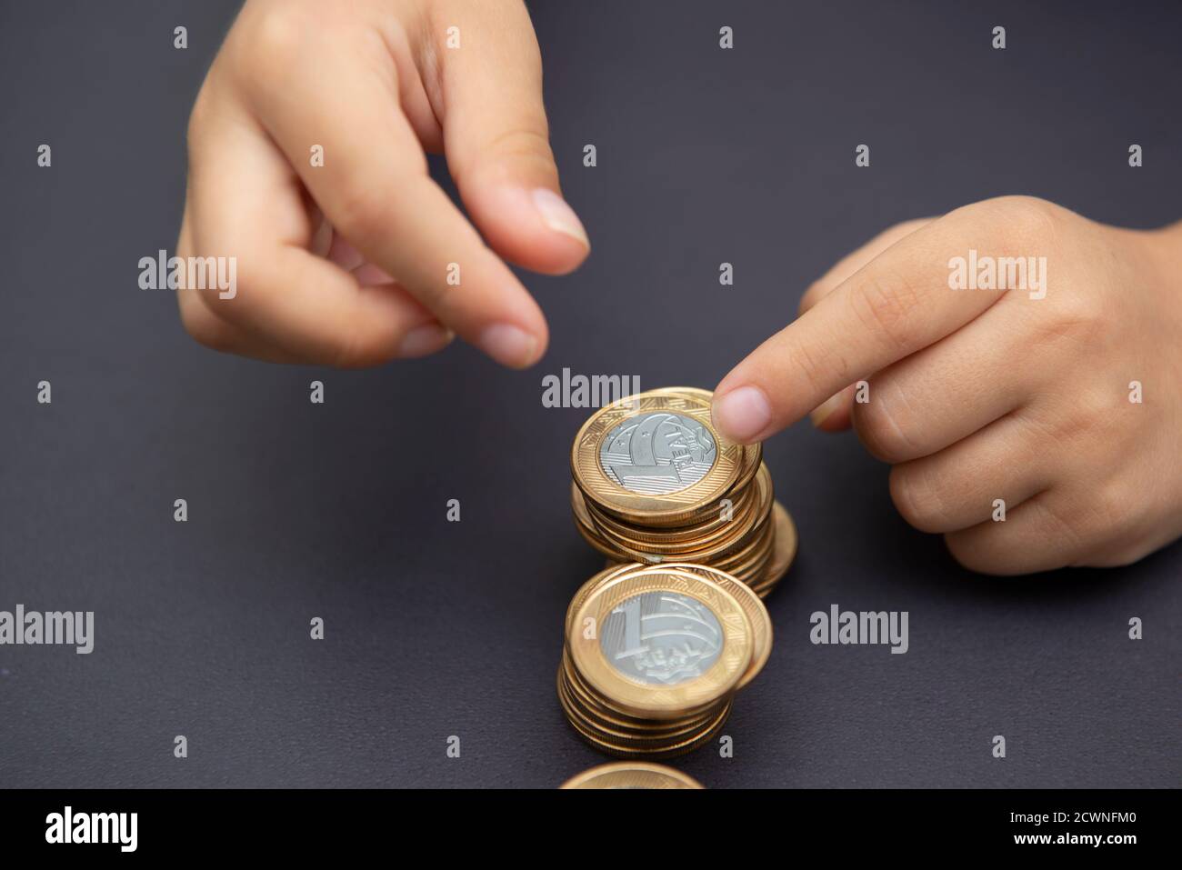 Man on pile of money hi-res stock photography and images - Alamy