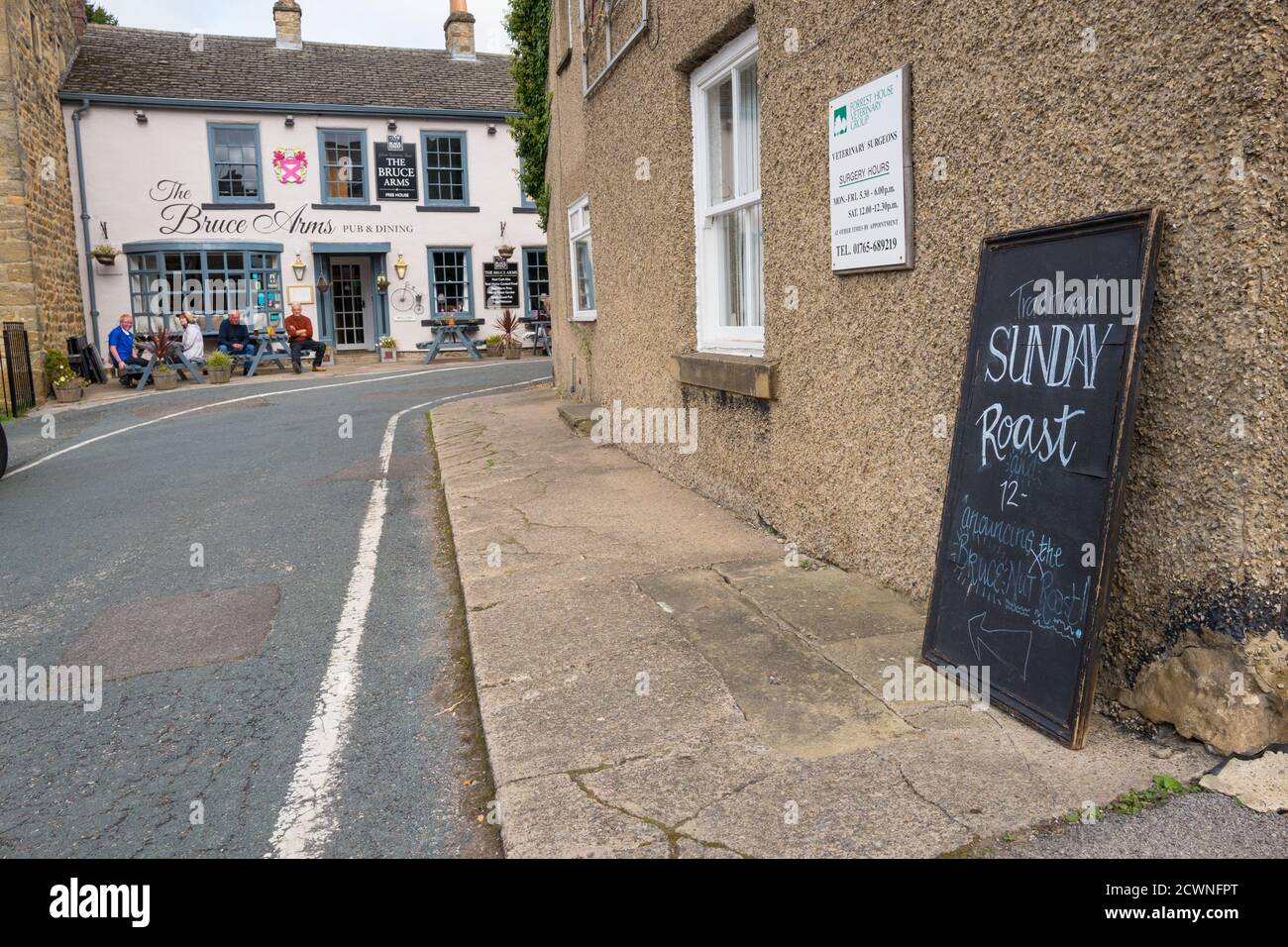 Customers sitting outside The Bruce Arms in Masham in the Yorkshire ...