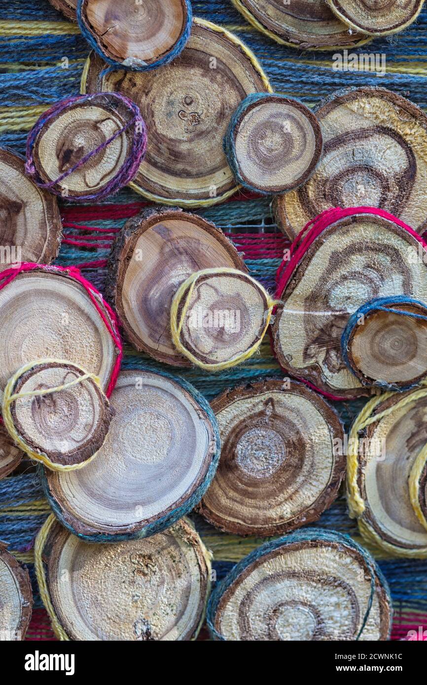 handmade jewelery made from tree trunks and colored thread Stock Photo ...