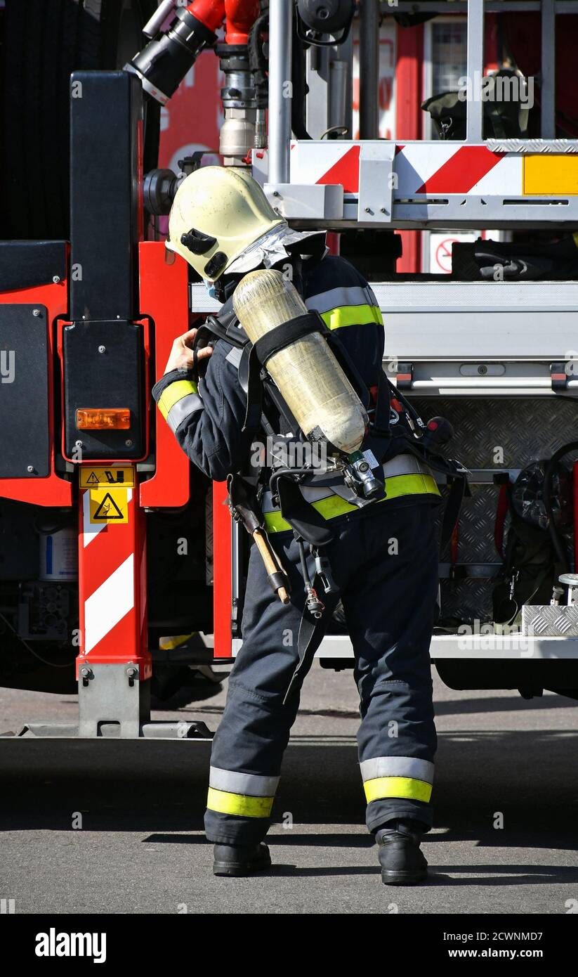 Firefighter at the scene of a fire Stock Photo - Alamy