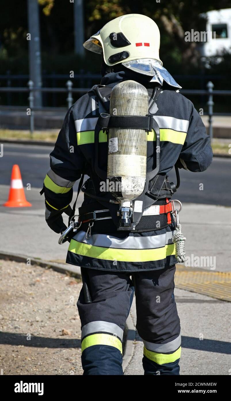 Firefighter at the scene of a fire Stock Photo - Alamy