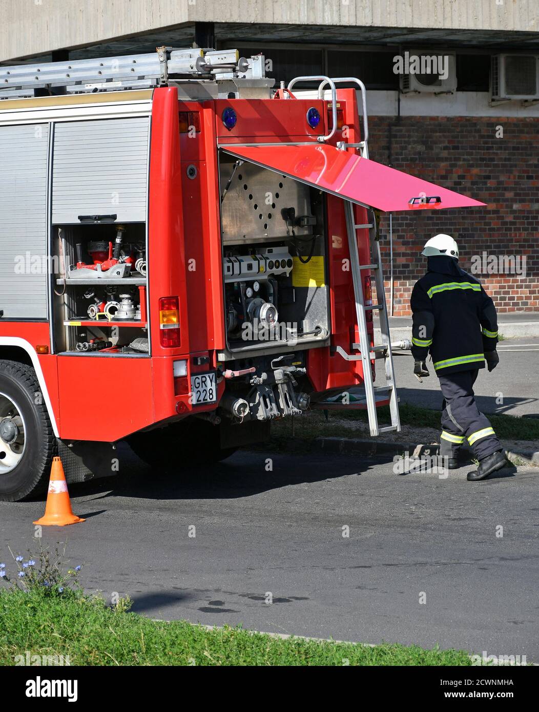 Firefighter at the scene of a fire Stock Photo - Alamy
