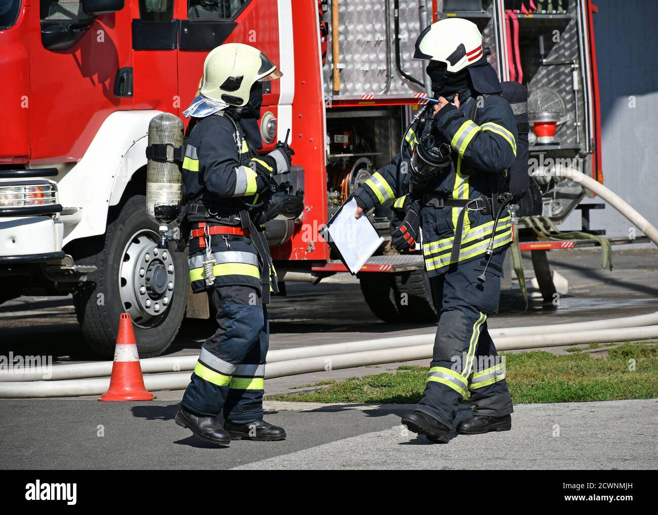 Firefighter at the scene of a fire Stock Photo - Alamy