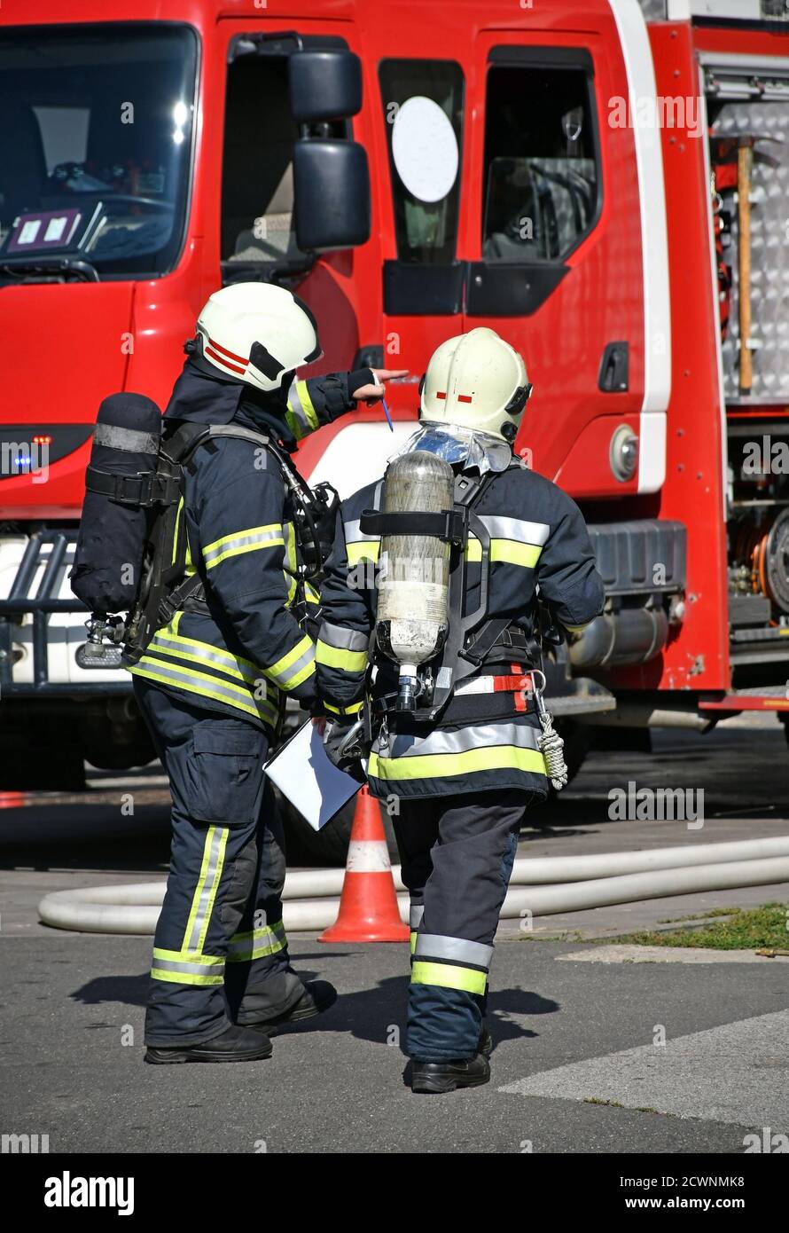 Firefighter at the scene of a fire Stock Photo - Alamy
