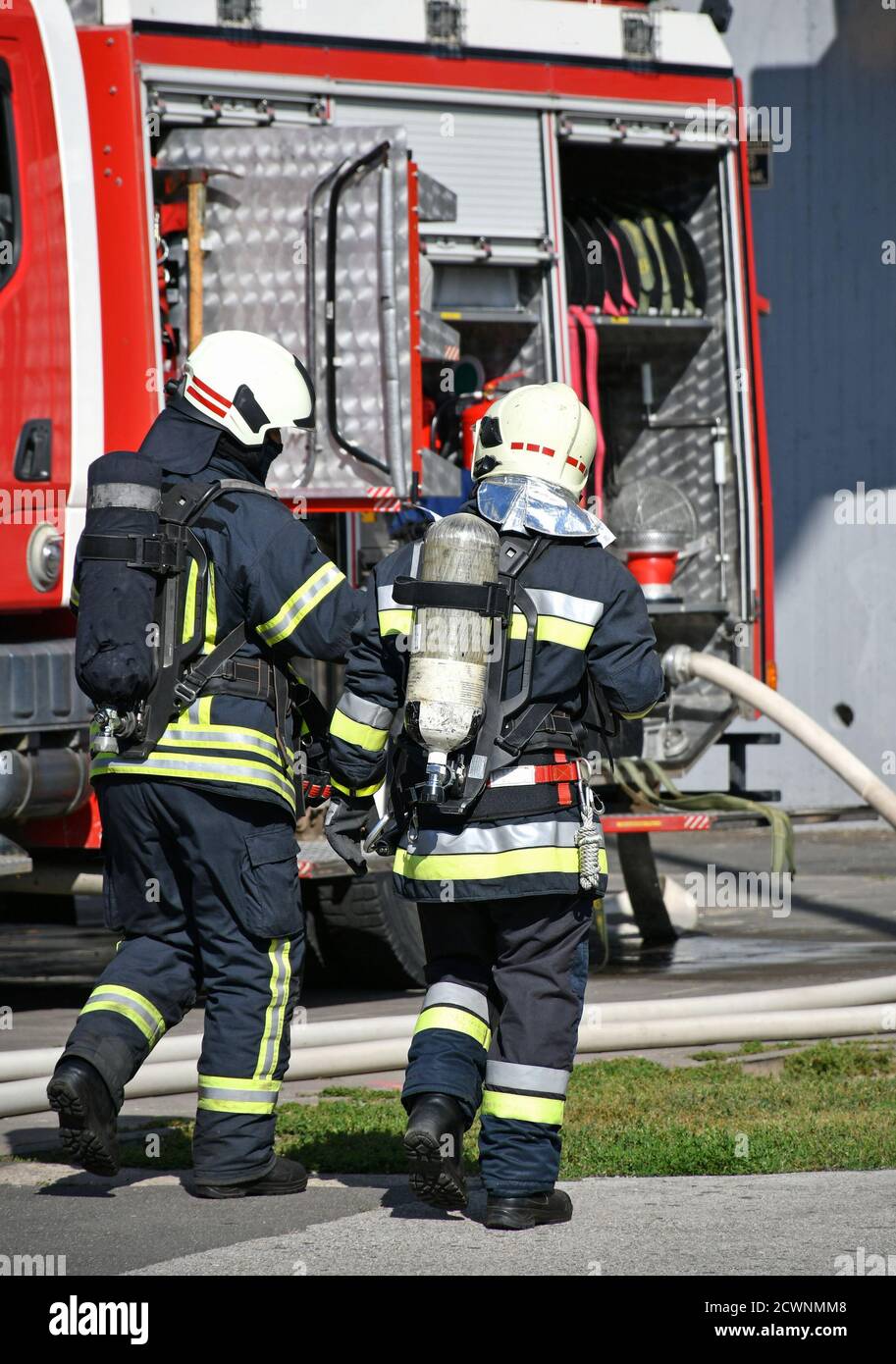 Firefighter at the scene of a fire Stock Photo - Alamy