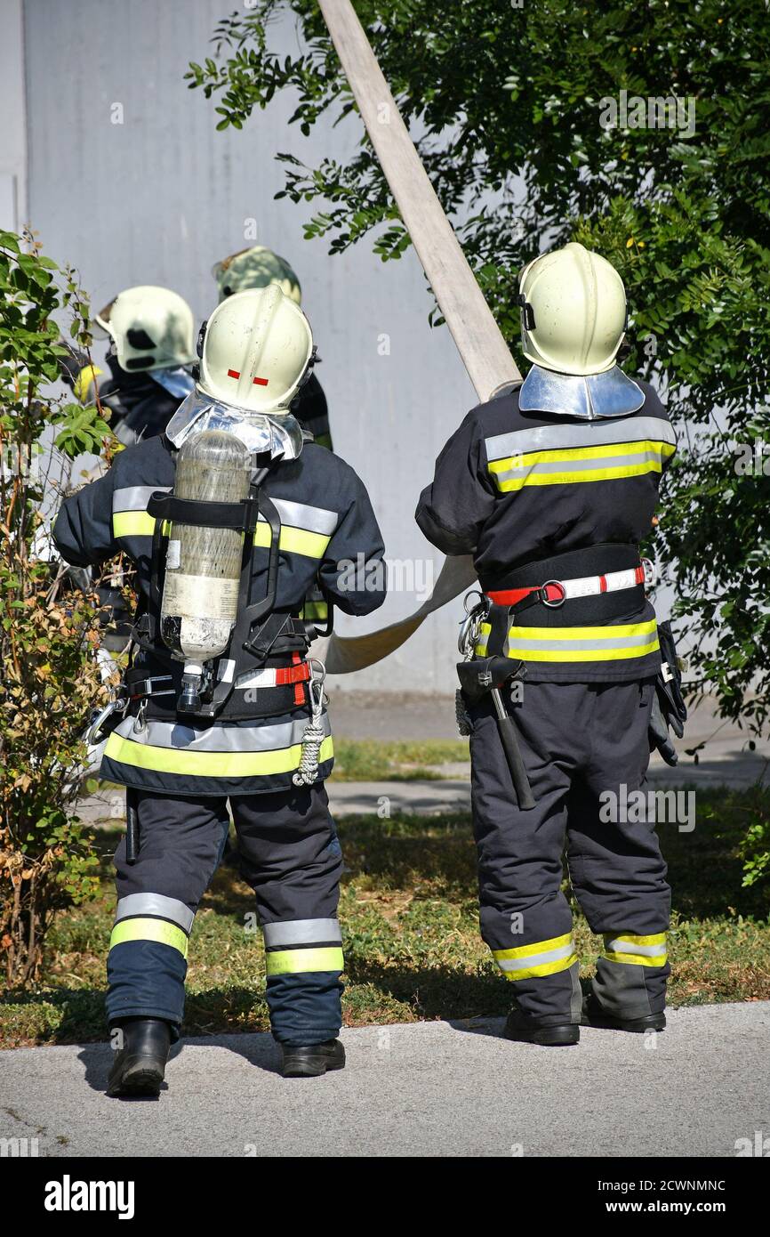 Firefighter at the scene of a fire Stock Photo - Alamy