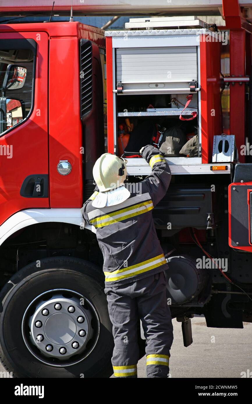 Firefighter at the scene of a fire Stock Photo - Alamy