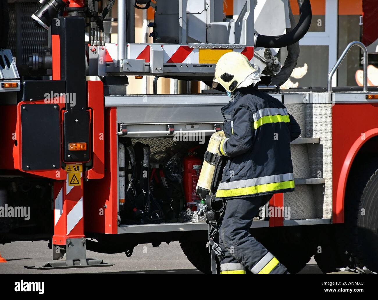 Firefighter at the scene of a fire Stock Photo - Alamy