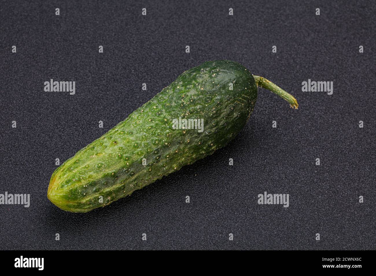 Green ripe fresh one cucumber over background Stock Photo - Alamy