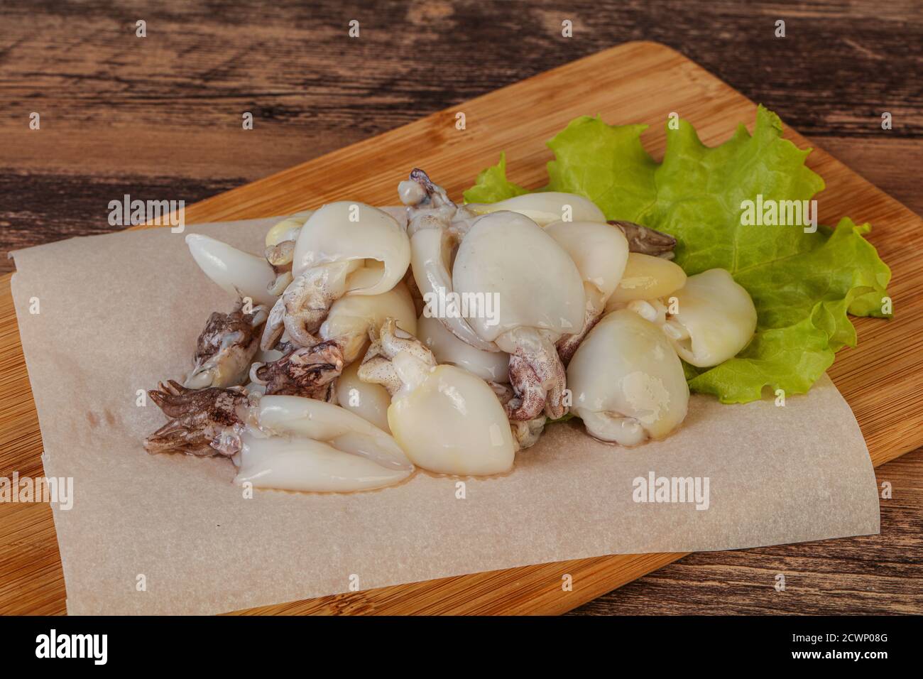 Raw seafood - cuttlefish for cooking over board Stock Photo - Alamy