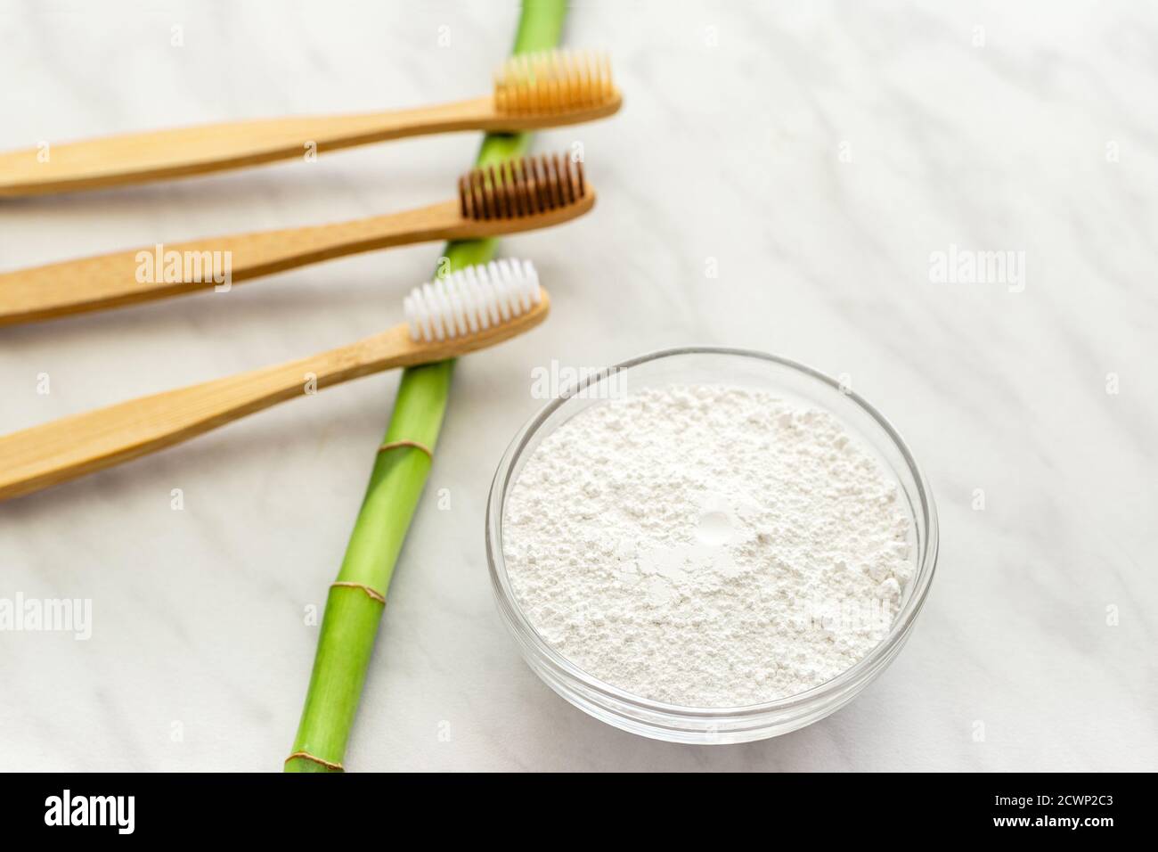 Bamboo toothbrush, bamboo plant dentifrice tooth powder on white marble ...