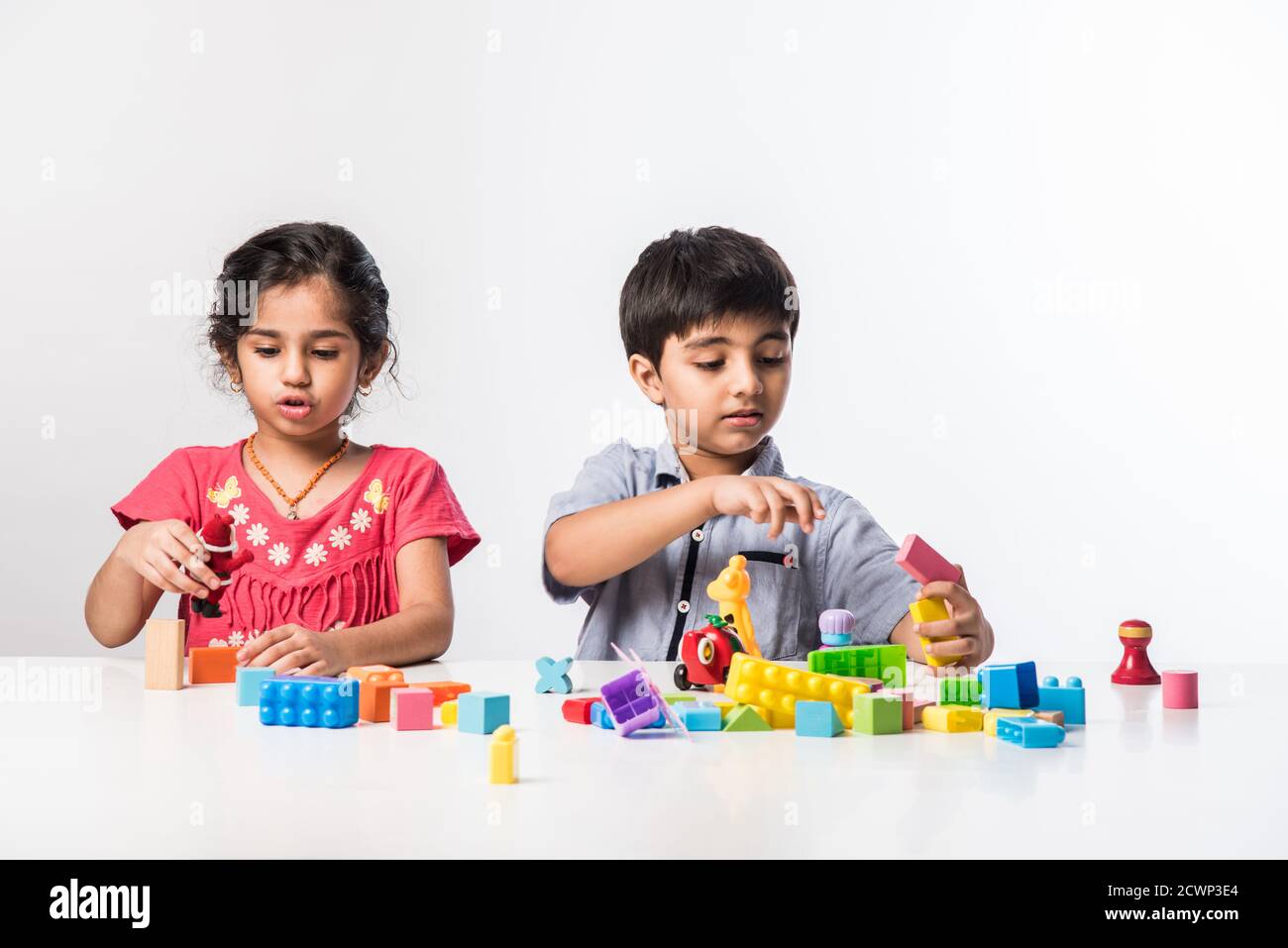 Adorable kids playing together blocks hi-res stock photography and ...