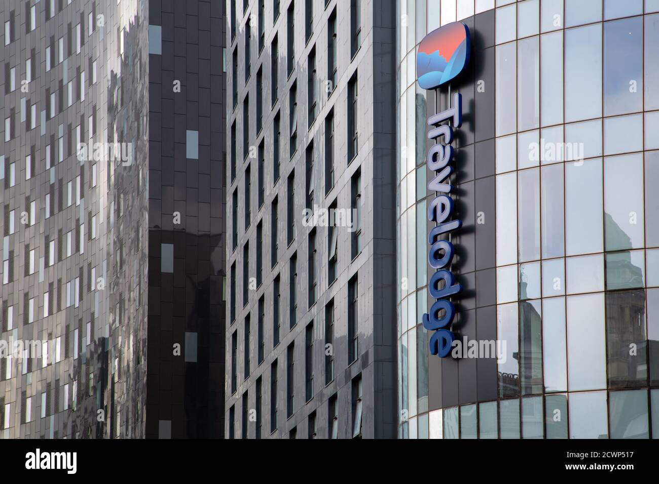 The exterior of a new Travelodge Hotel showing the logo and adjacent ...