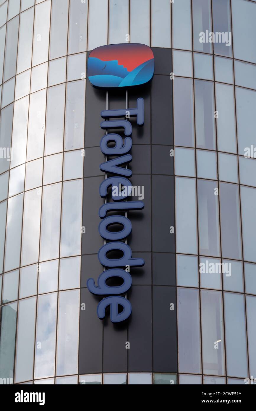 The Travelodge hotel sign on the front of a modern hotel block Stock ...