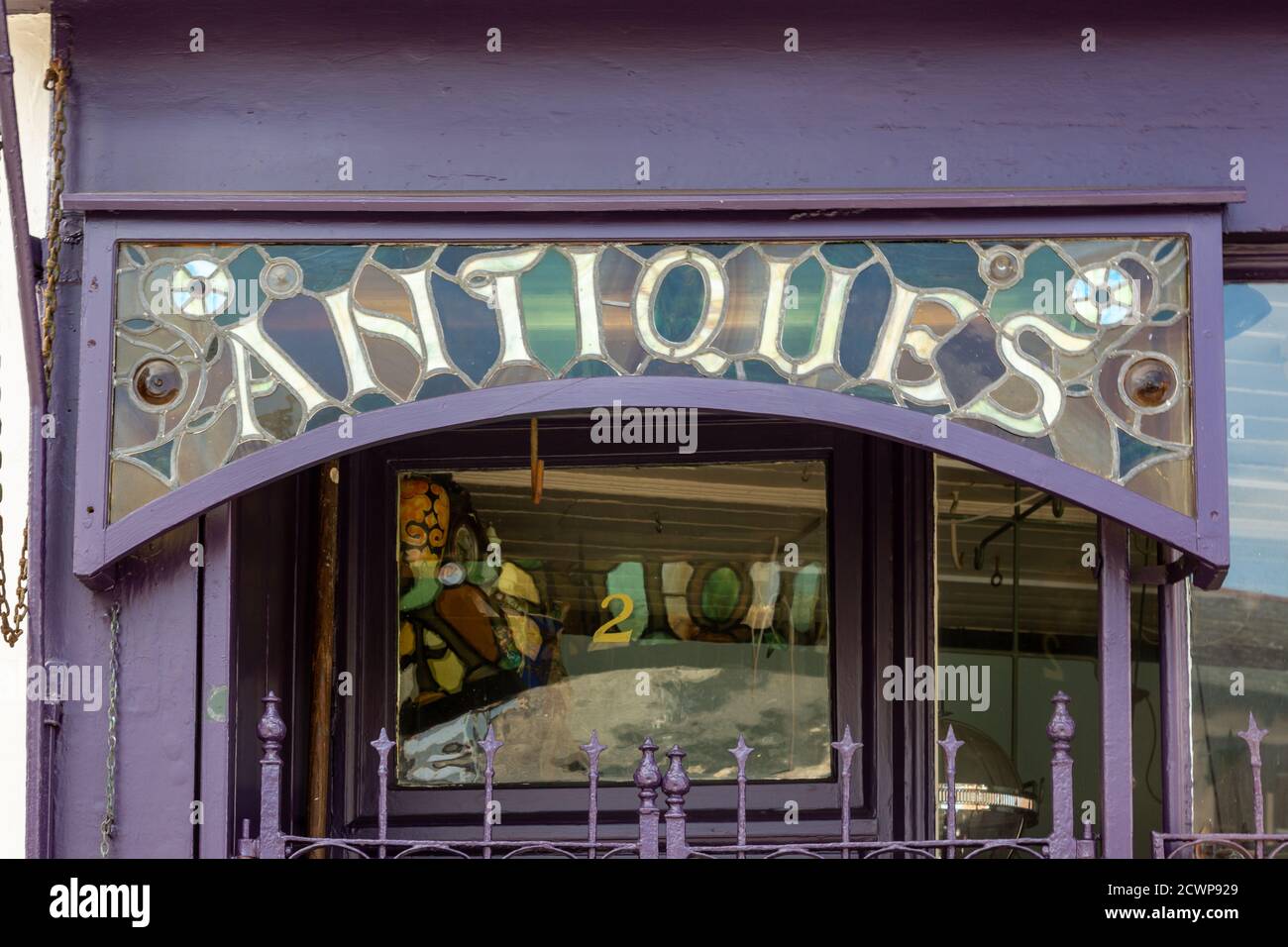 The sign above an antiques shop reading Antiques Stock Photo - Alamy