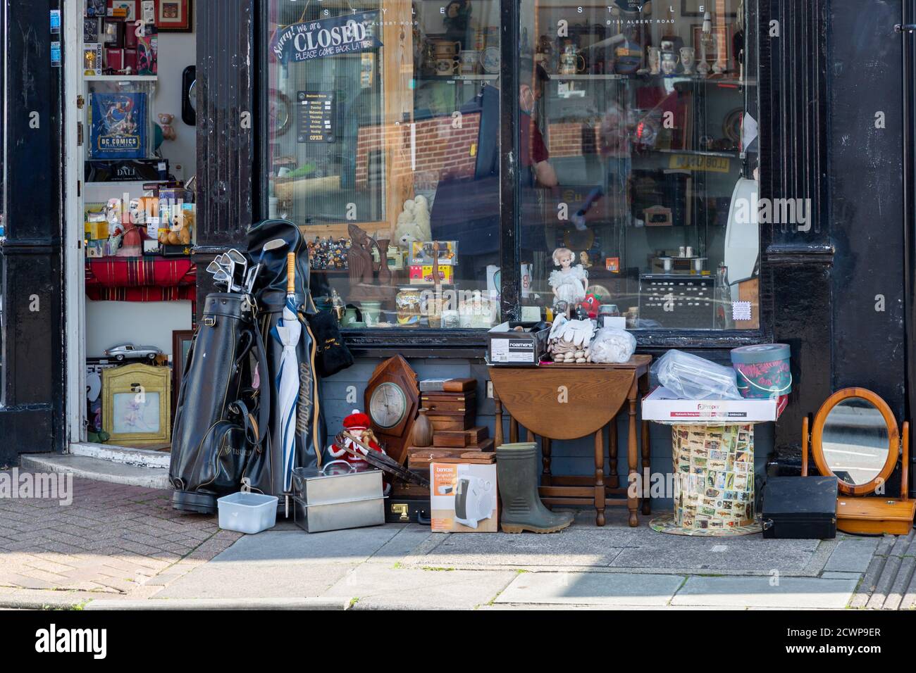 Various items for sale shown outside a brick a brack shop or antiques ...