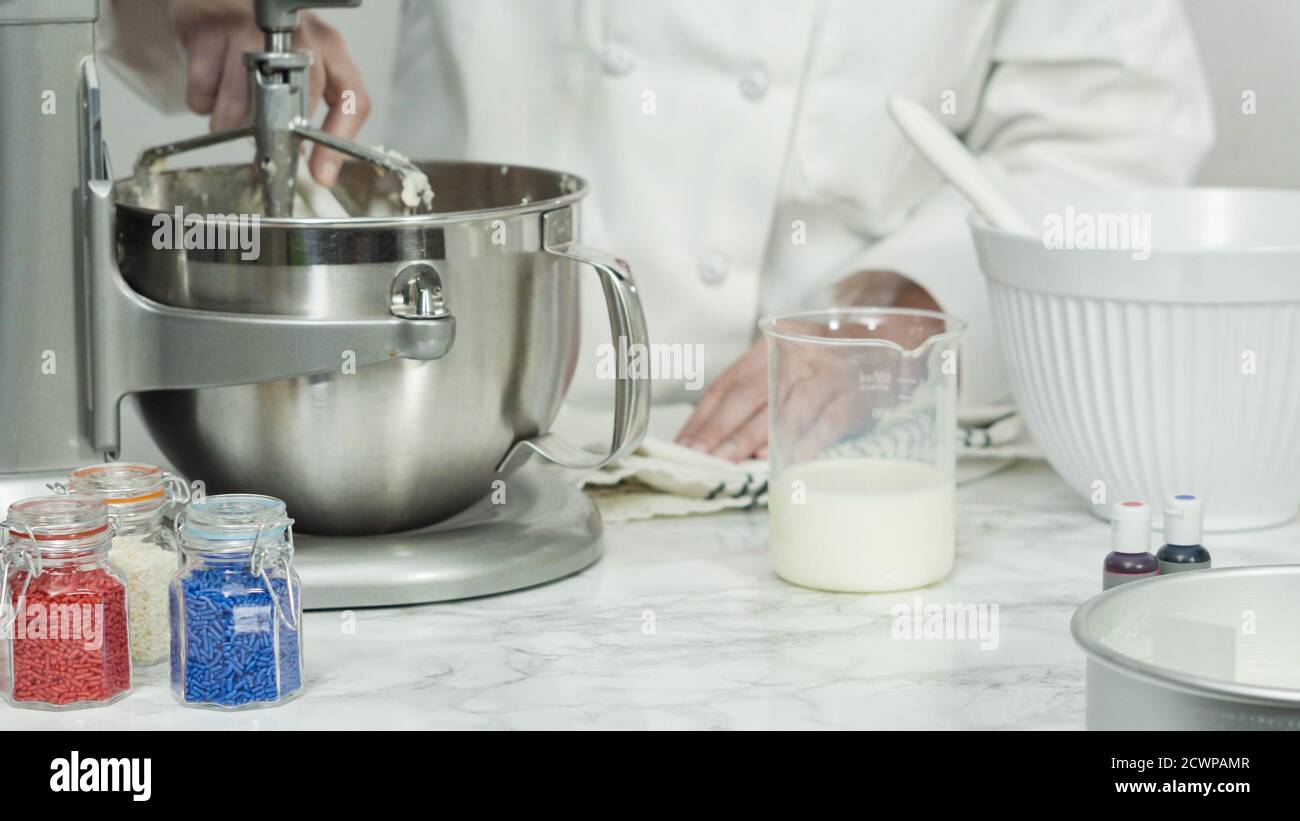 Step by step. Mixing ingredients in standing kitchen mixer to bake a ...