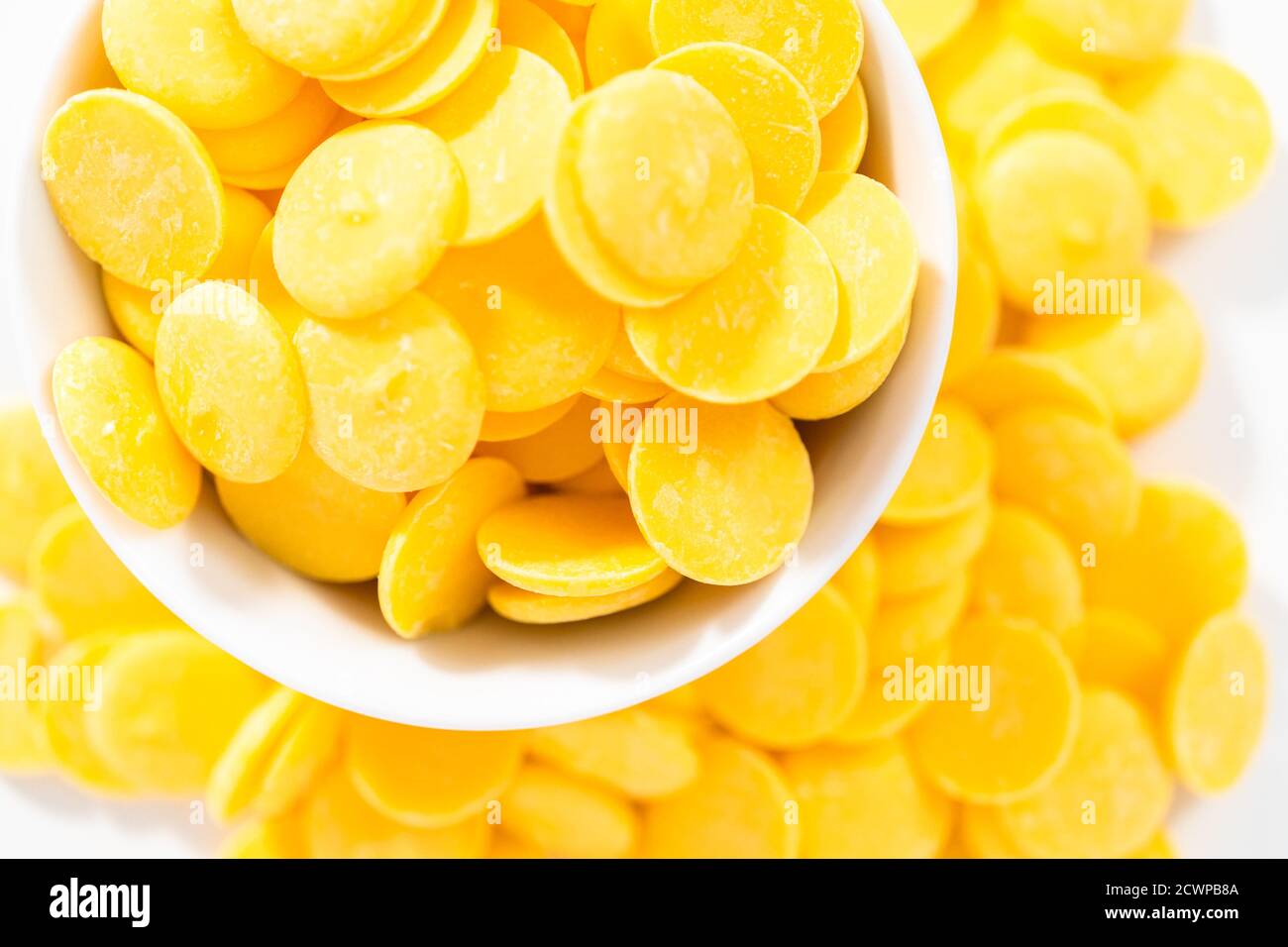 Yellow round chocolate chips for melting chocolate shapes Stock Photo ...