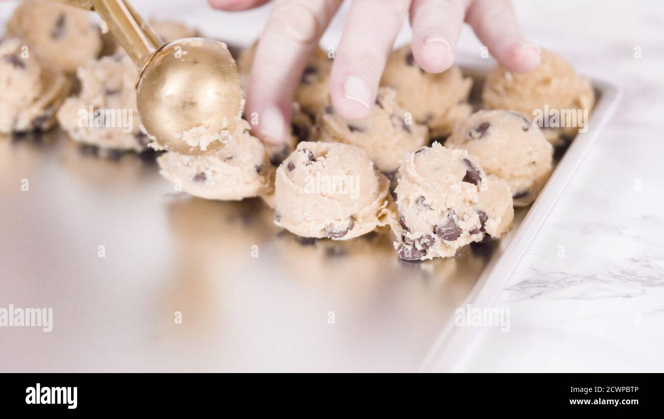 Step by step. Scooping homemade chocolate chip cookies with metal dough ...