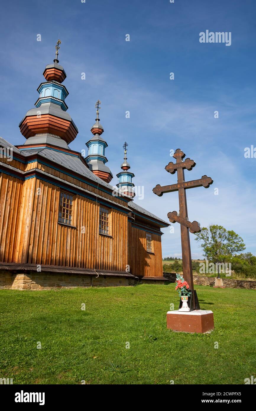 Wooden Orthodox cross at wooden Orthodox church in Komancza, in eastern ...
