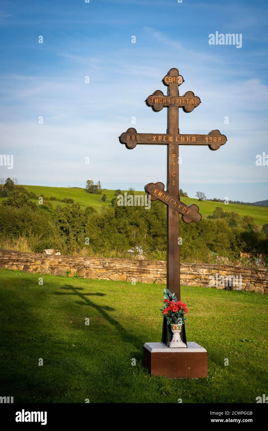 Wooden Orthodox cross at wooden Orthodox church in Komancza, in eastern ...