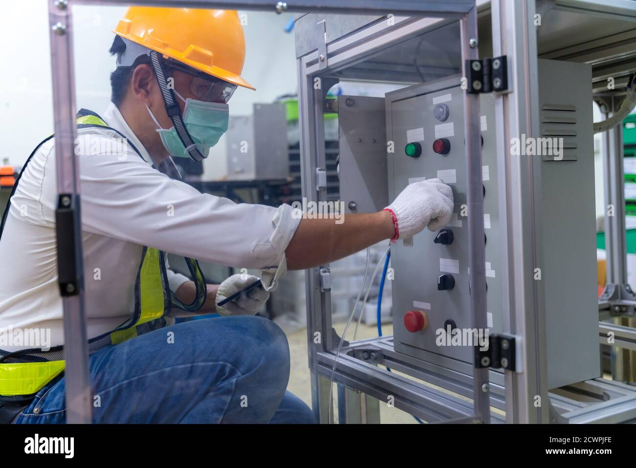 Asian man Mechanic wearing protective mask to Protect Against Covid-19 ...
