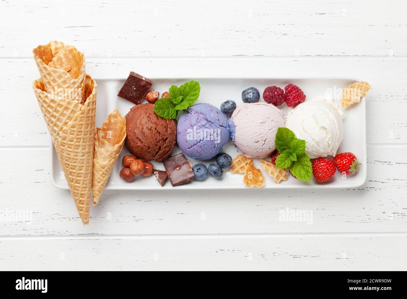 Berry, vanilla and chocolate ice cream sundae. Top view flat lay Stock ...