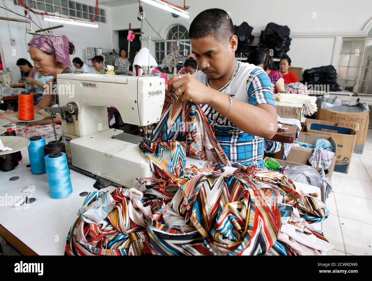 Workers sews garment for the hi-res stock photography and images - Alamy