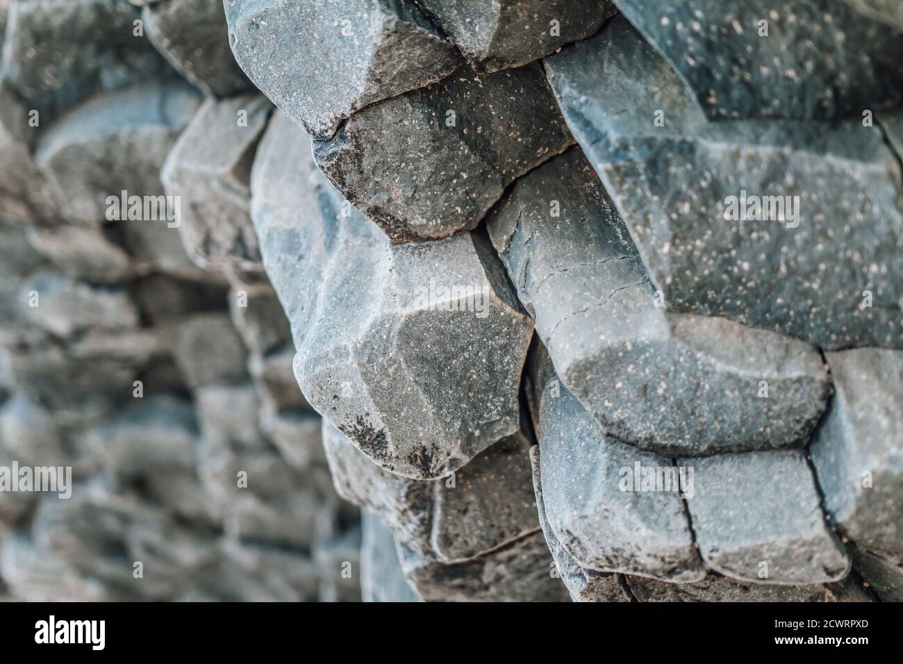 Natural stone texture. Basalt lava formations like columns. Icelandic ...