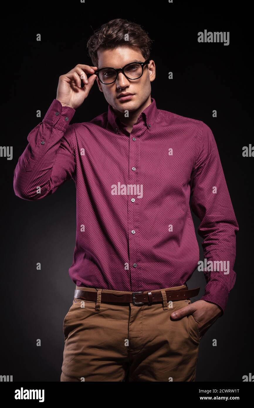 Guy putting hands in pockets hi-res stock photography and images - Alamy