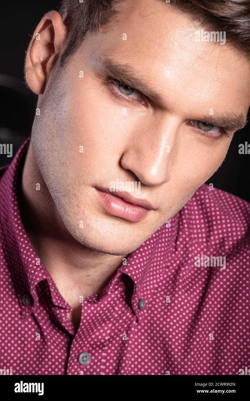 Close up picture of a young casual man with blue eyes Stock Photo - Alamy