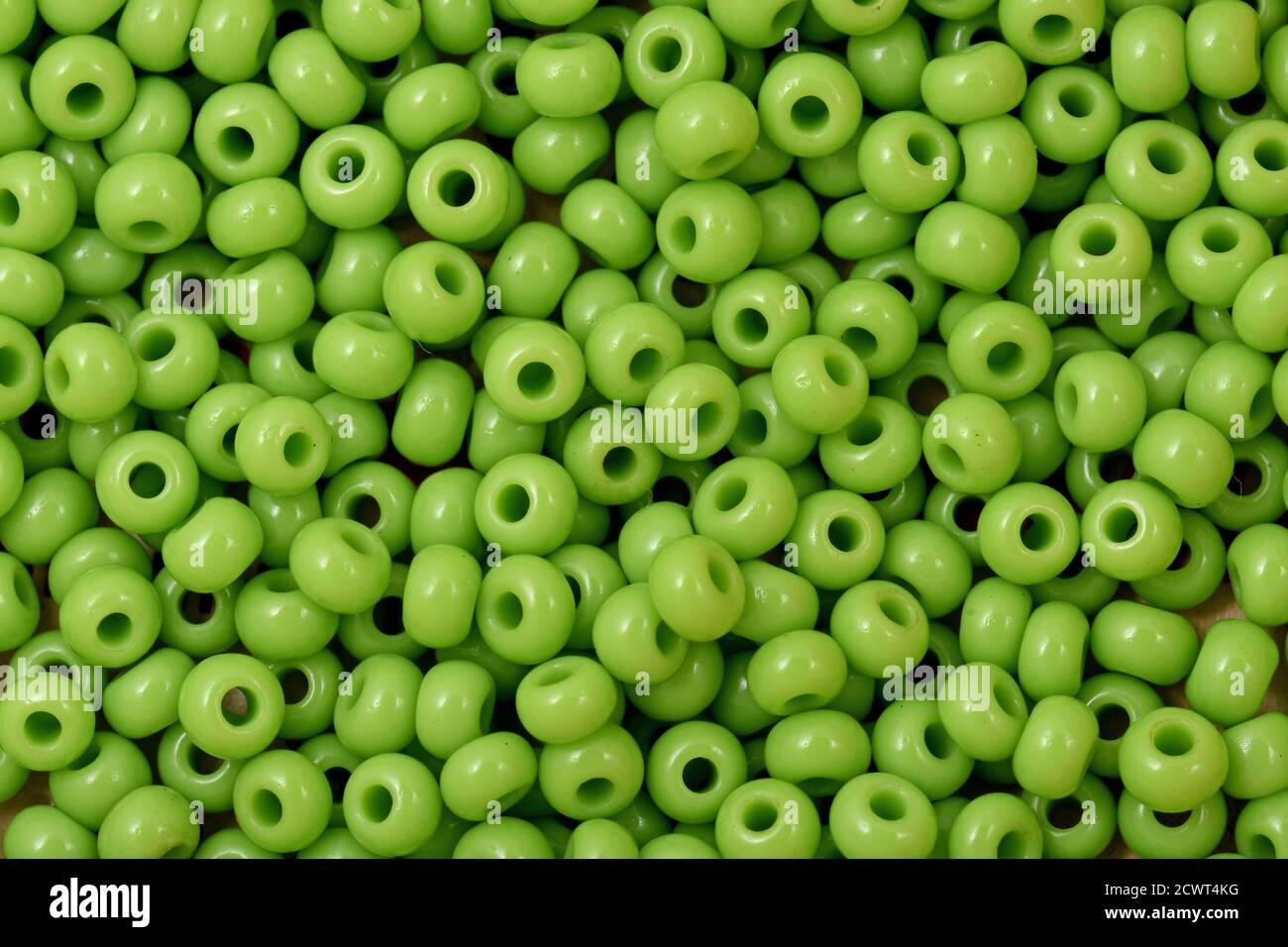 Light green Beads on the white background. Background or texture of ...