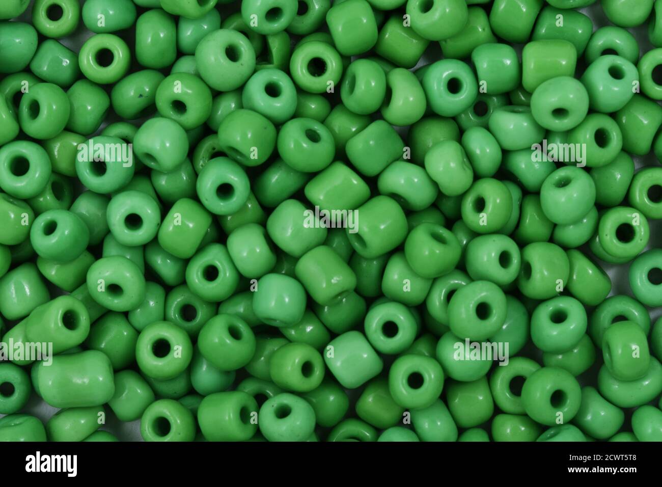 Green Beads on the white background. Background or texture of beads ...