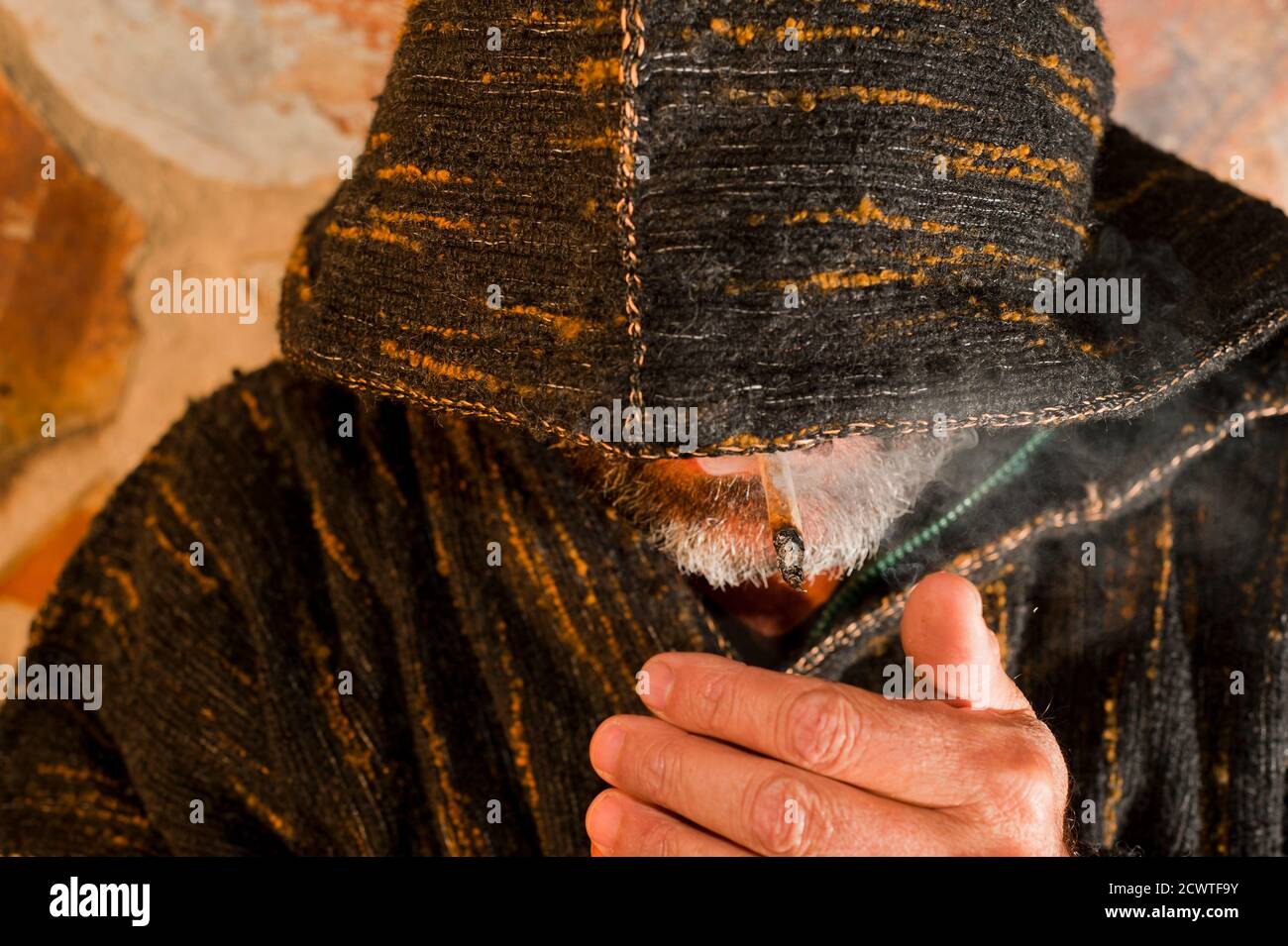 man hands with dark green chilaba, protects from the wind to light ...