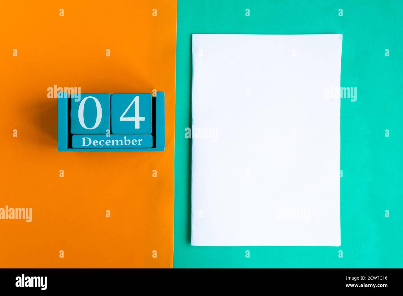 December 4. Blue cube calendar with month and date and white mockup ...