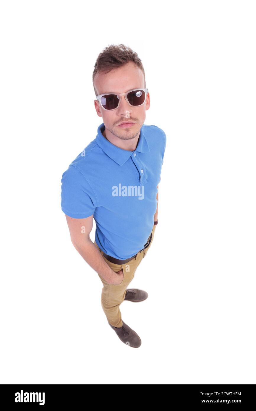 top view of a casual young man looking into the camera with his hands ...