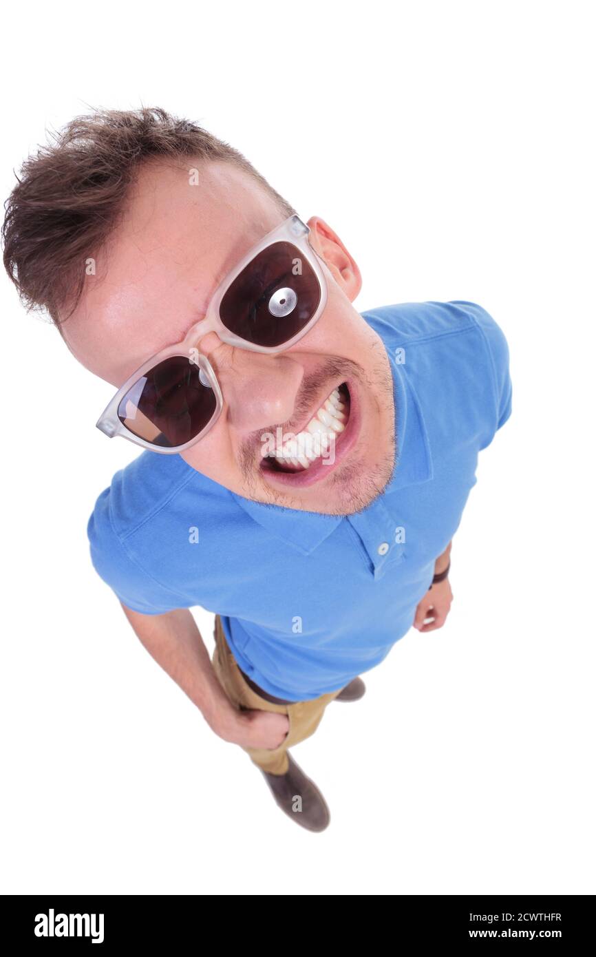 top view of a casual young man with a large smile on his face. on a ...