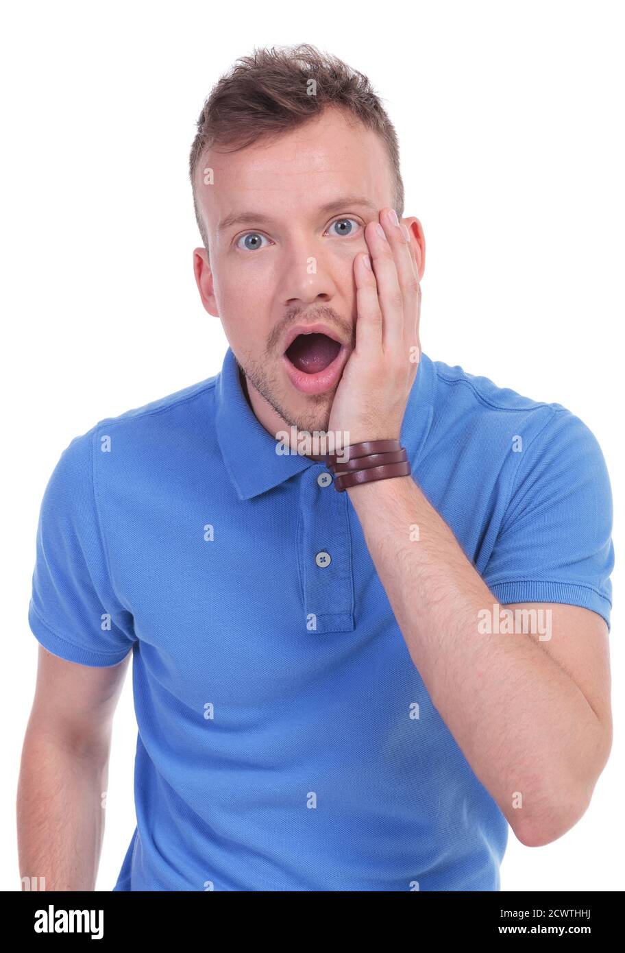 picture of a young casual man with a shocked expression on his face ...