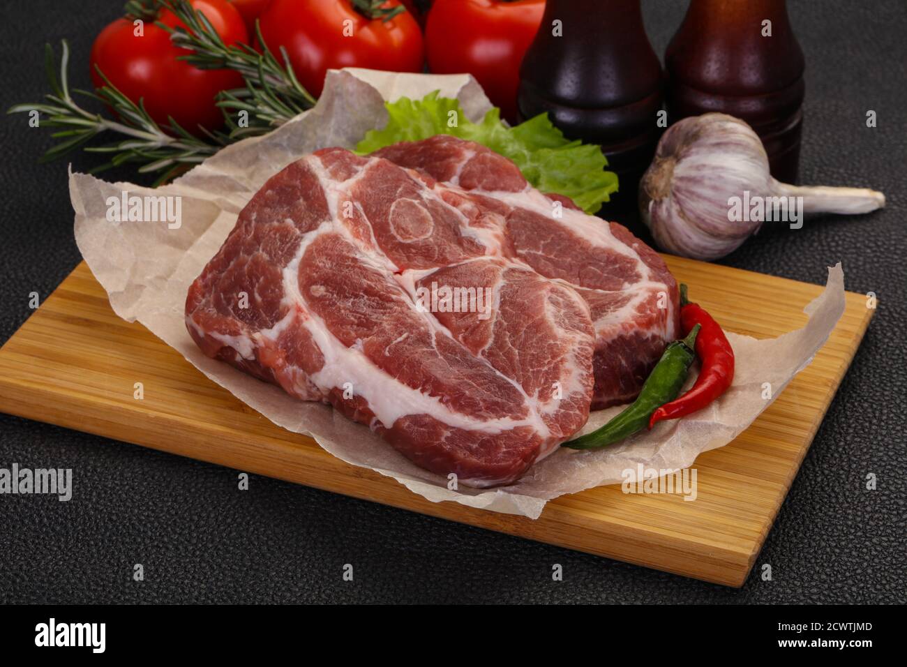 Raw pork neck steak ready for cooking Stock Photo - Alamy