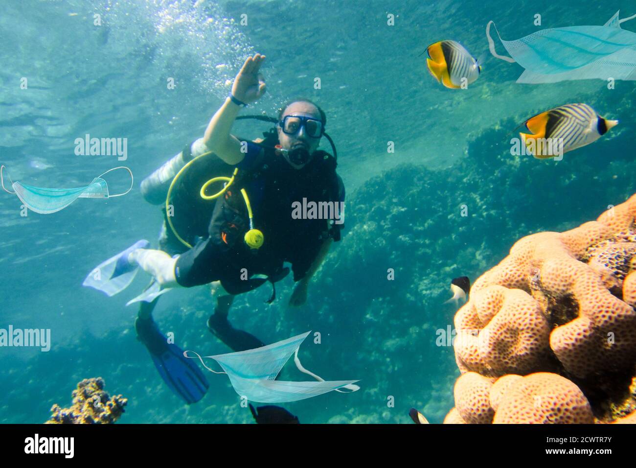 Diver and face masks under water. Environment pollution of surgical ...