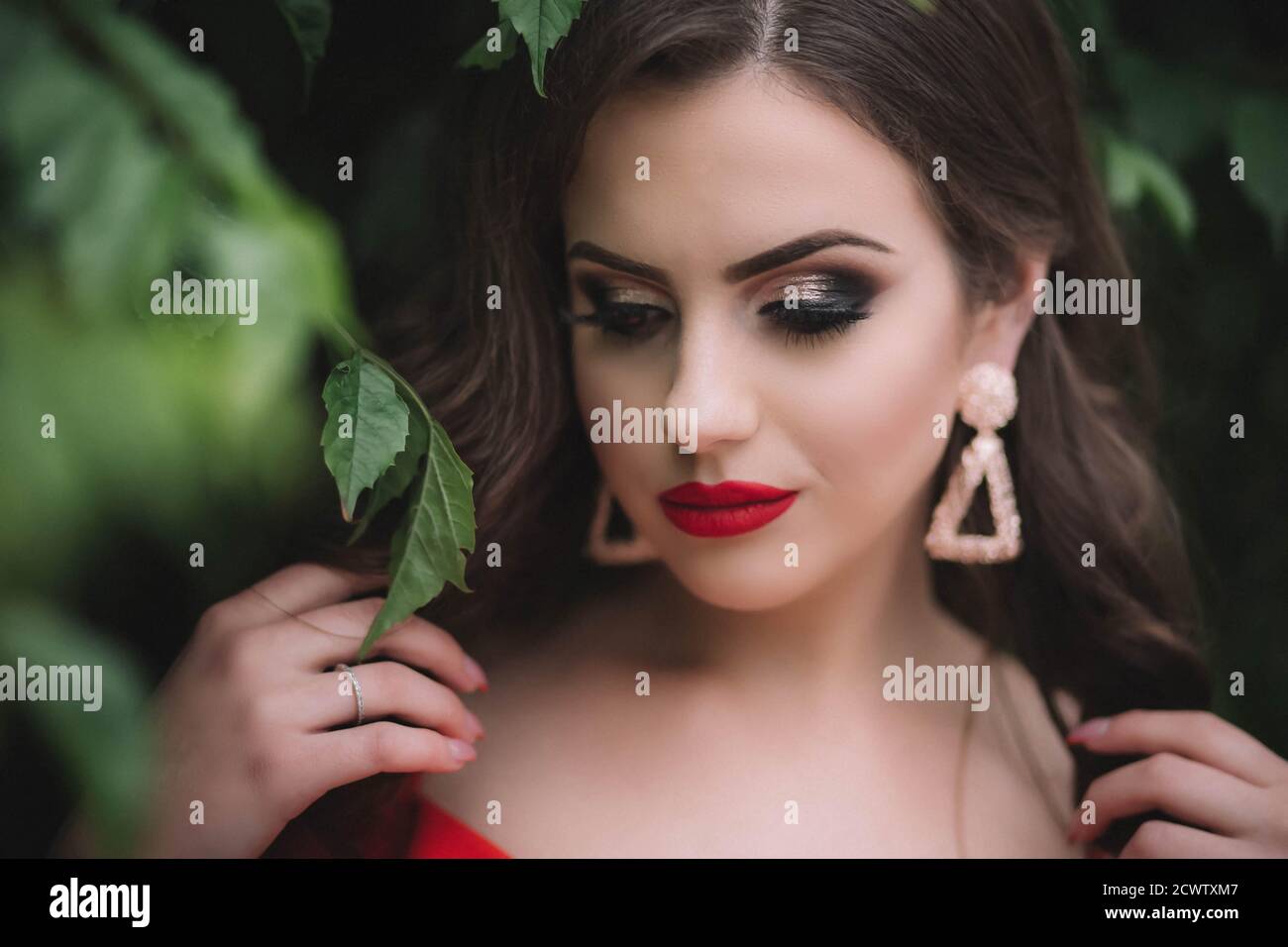 Beautiful young teen girl ready for prom. Head shot, bijoux earrings ...