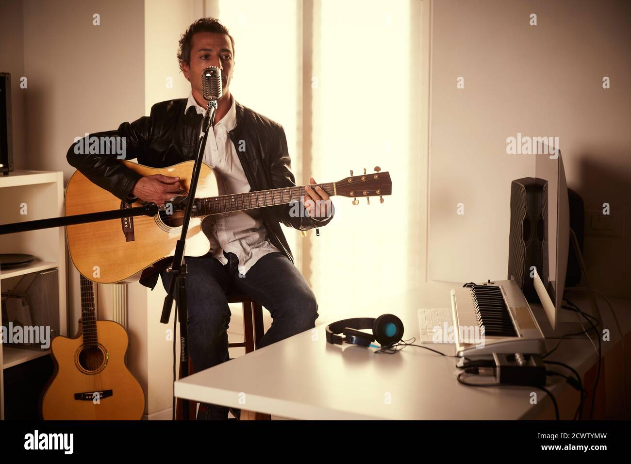 guitar player recording at home studio Stock Photo - Alamy